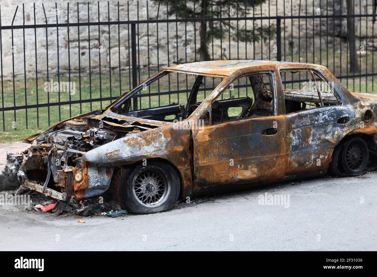 The burned rusty car on a street Stock Photo - Alamy