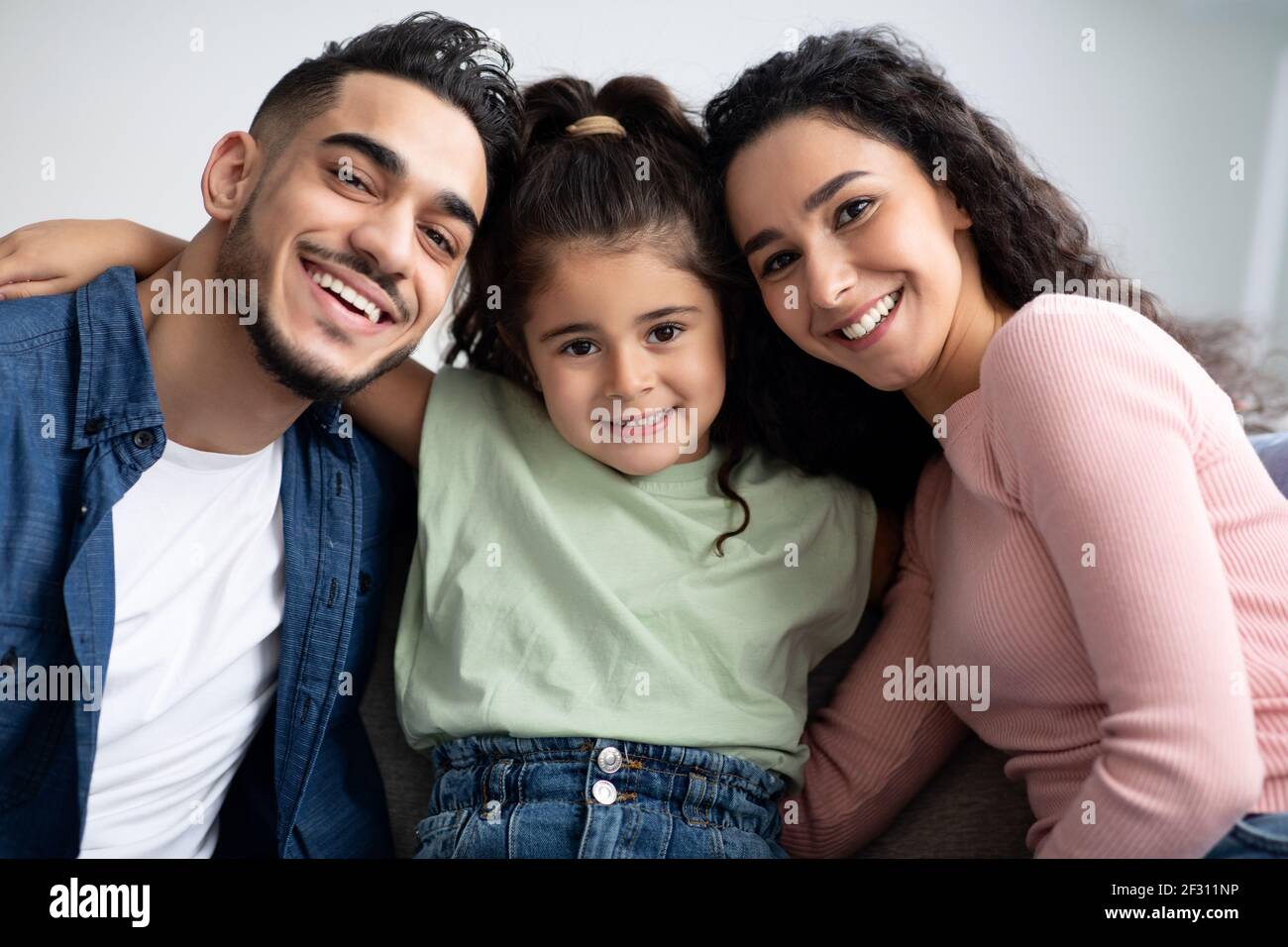 Closeup Portraif Of Happy Arabic Family Of Three With Little Daughter ...