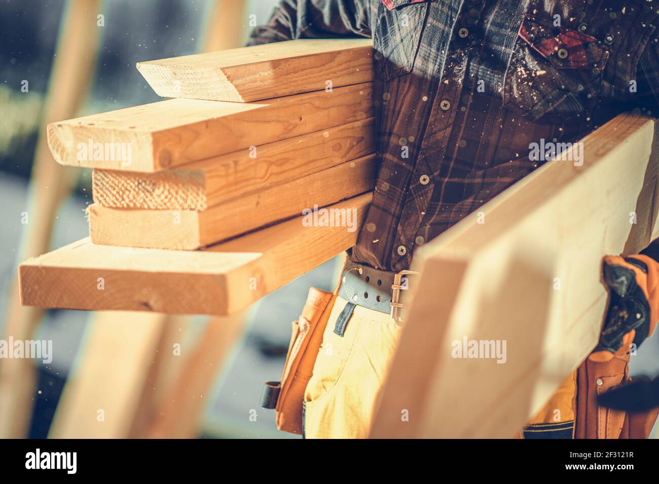 Construction Worker Moving Pieces of Wood Beams in Construction Zone ...
