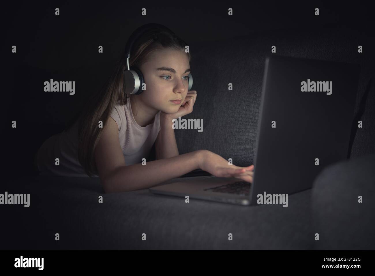 Caucasian Girl Browsing Internet and Learning on Her Laptop While ...