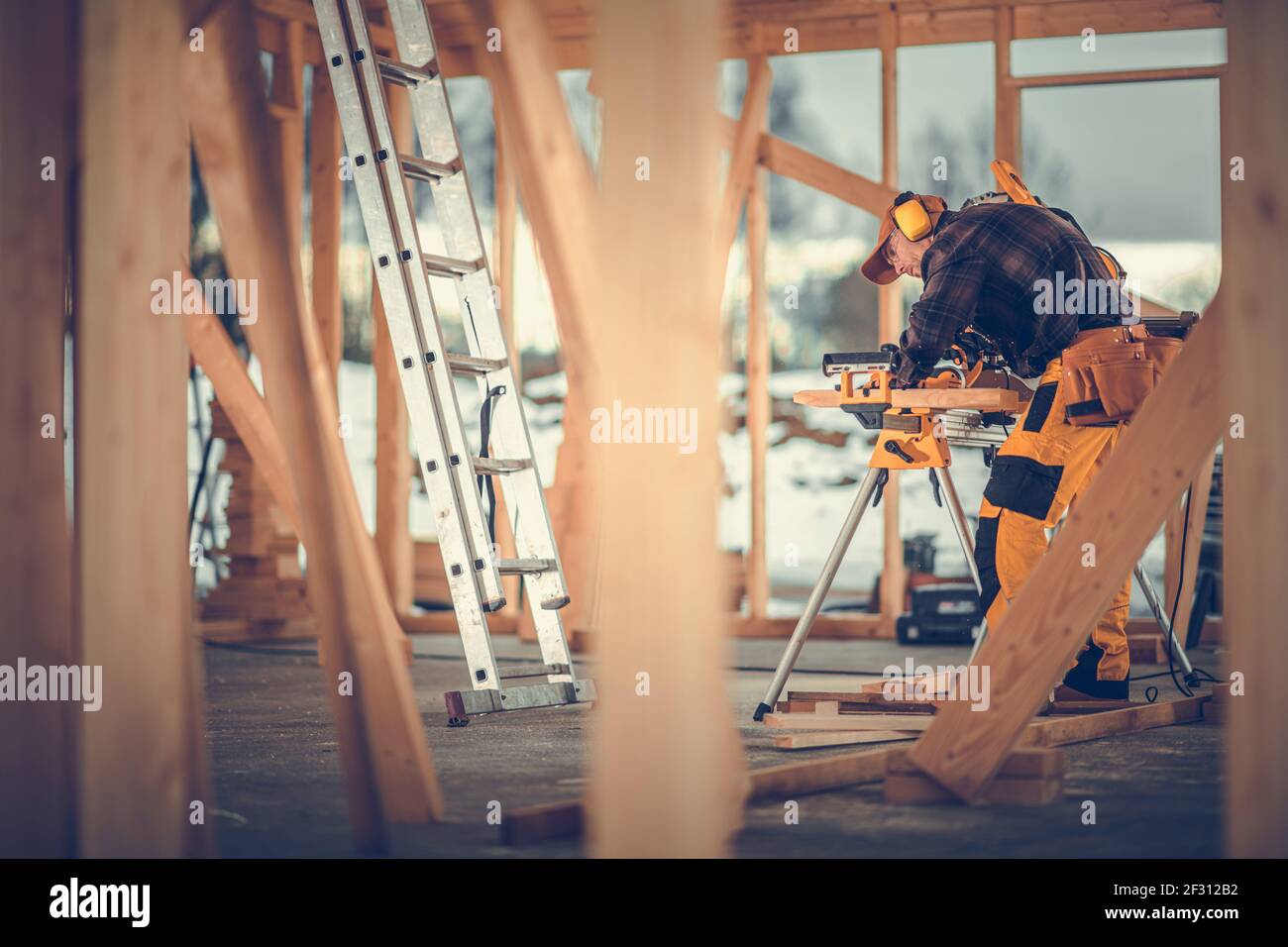 Caucasian Contractor Worker in His 40s Trimming Wooden Elements Using ...