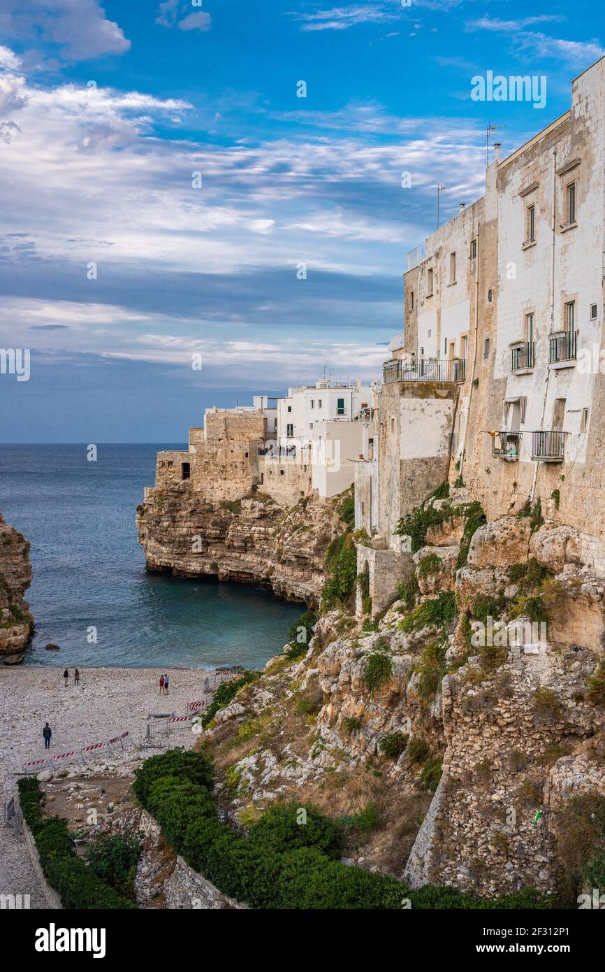 The beach of Polignano a Mare with its steep cliffs of the old town ...