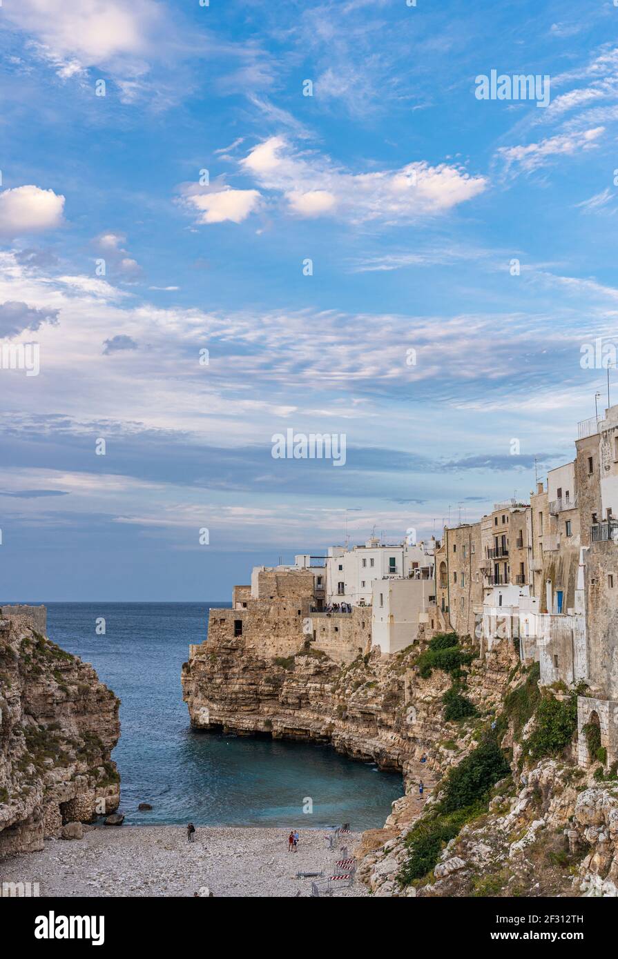 The beach of Polignano a Mare with its steep cliffs of the old town ...