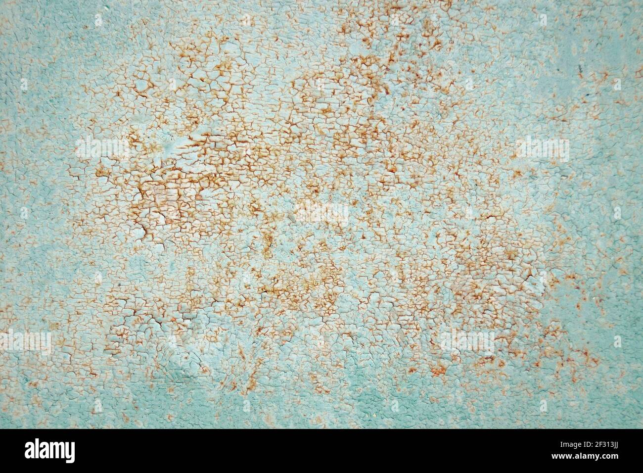 Brown, gray and orange rust on turquoise painted metal surface ...