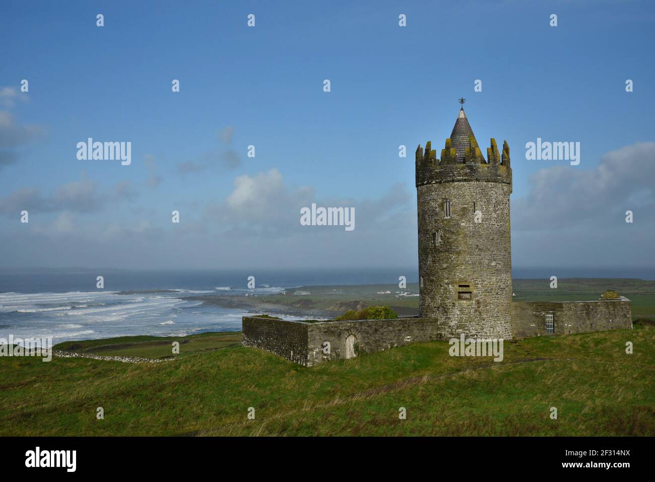 Irish landscape with panoramic view of Doonagore Castle overlooking the ...