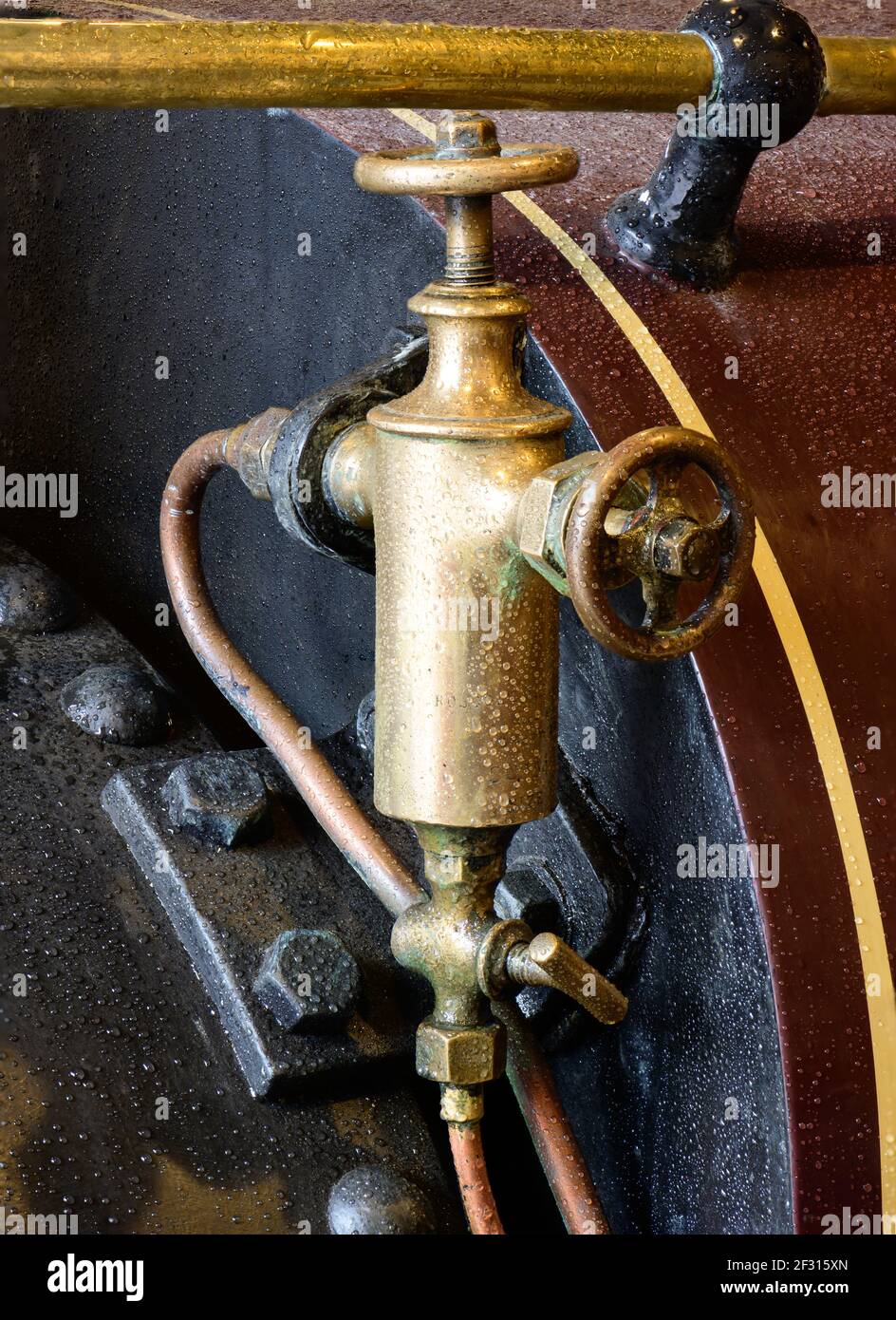 Brass valve on vintage steam engine 0318 Stock Photo - Alamy