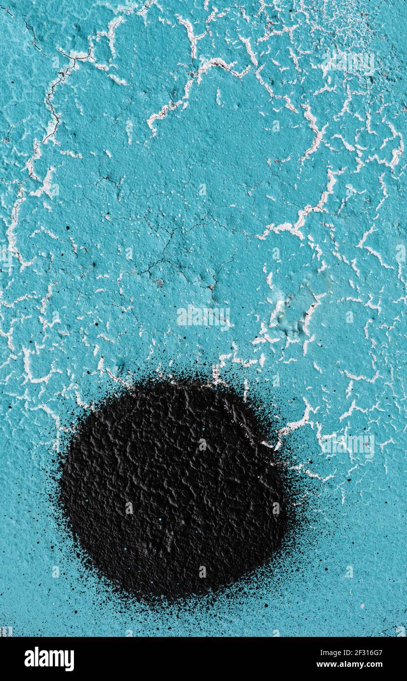 Black sprayed dot on blue cracked background texture Stock Photo - Alamy