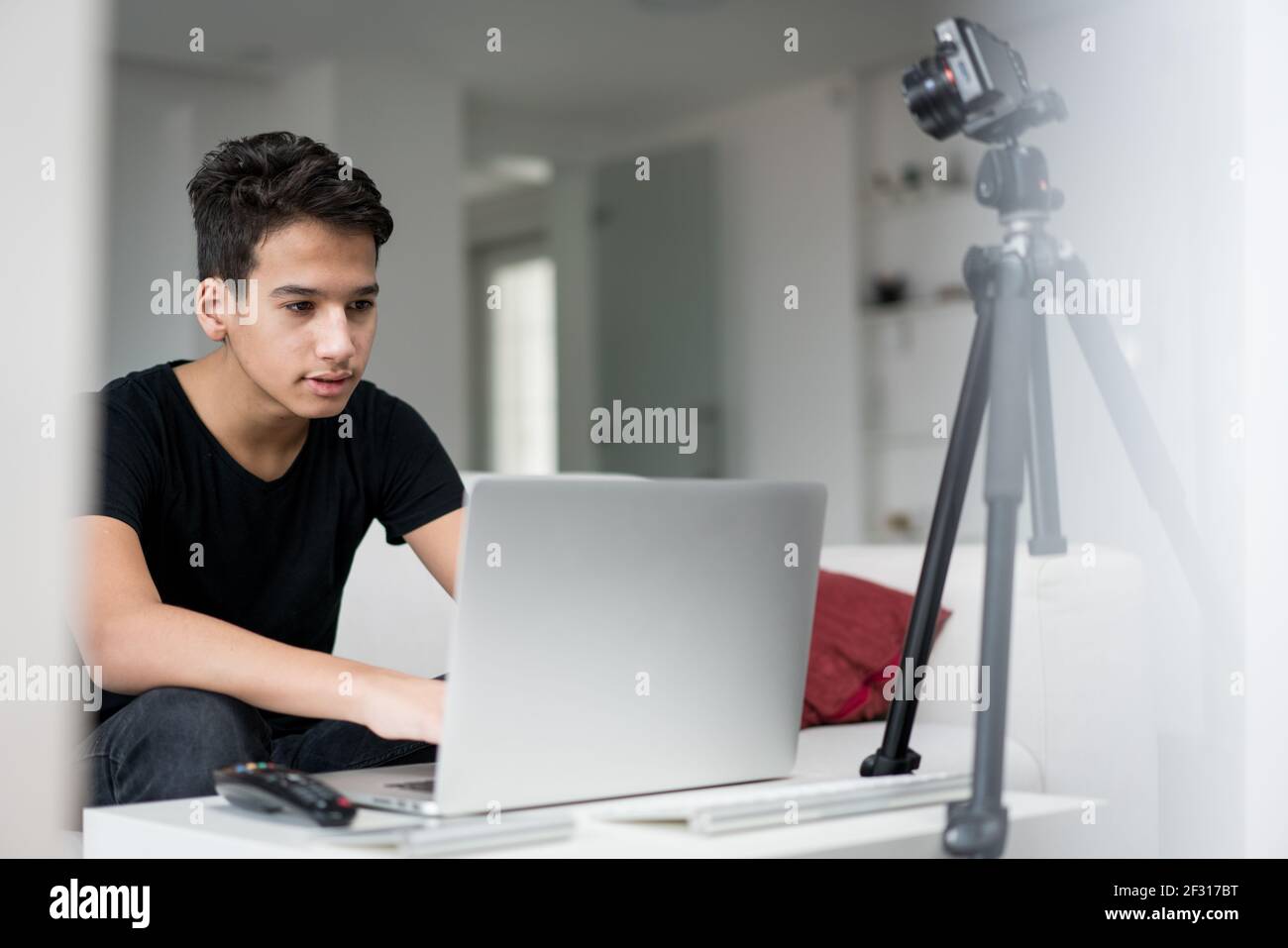 Young boy talking online using device and equipment Stock Photo - Alamy