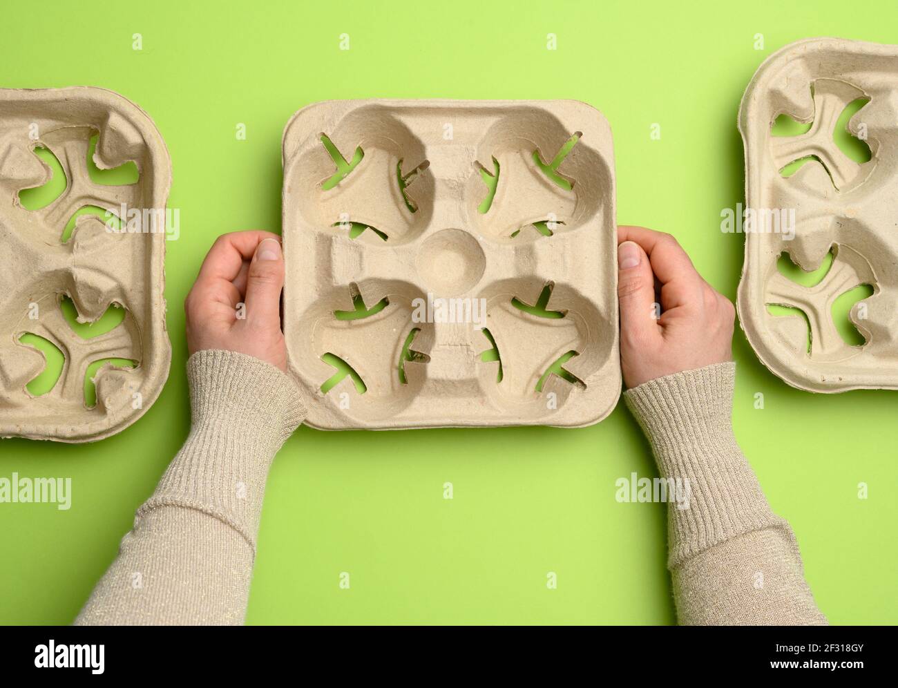 Paper tray for drinks in takeaway cups on four cups on a green ...