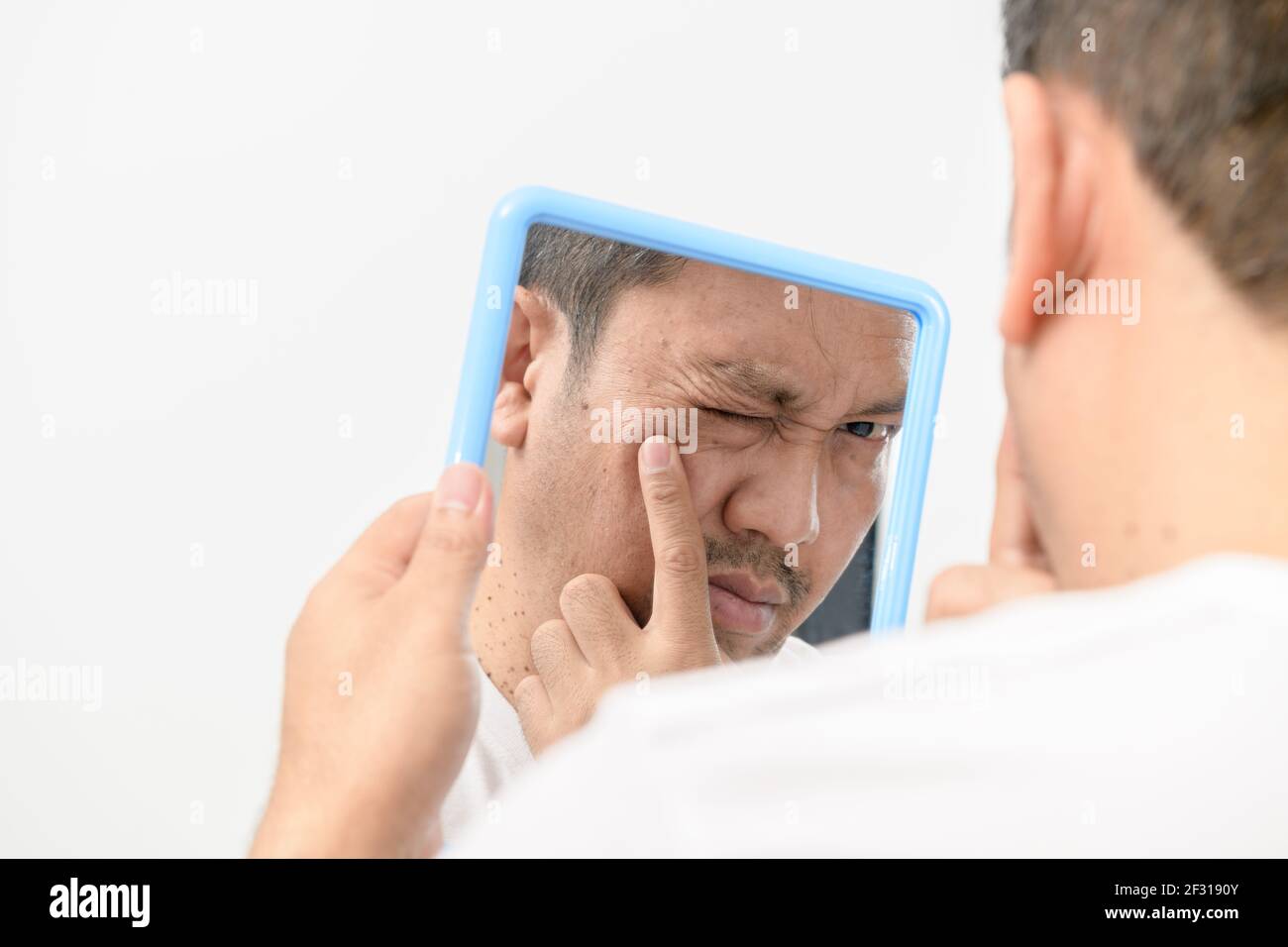 Depressed man looking mirror hi-res stock photography and images - Alamy