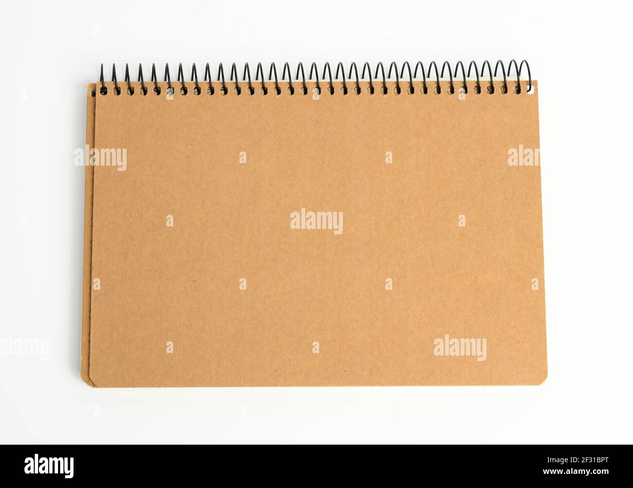 Closed notepad with brown sheets on a white background Stock Photo - Alamy