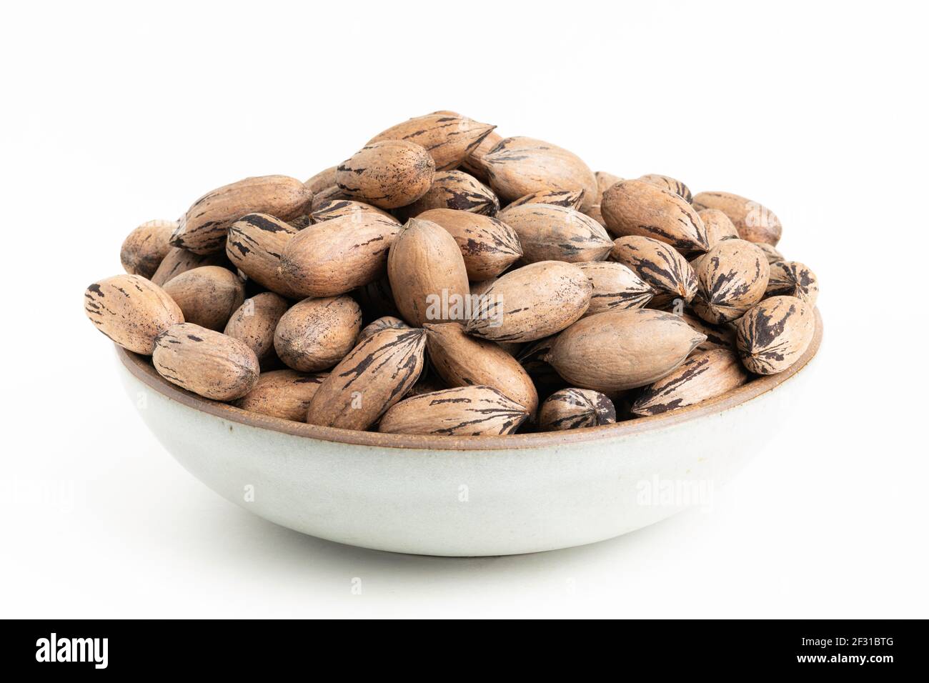 In-shell pecan nuts on bowl set on plain white background Stock Photo ...