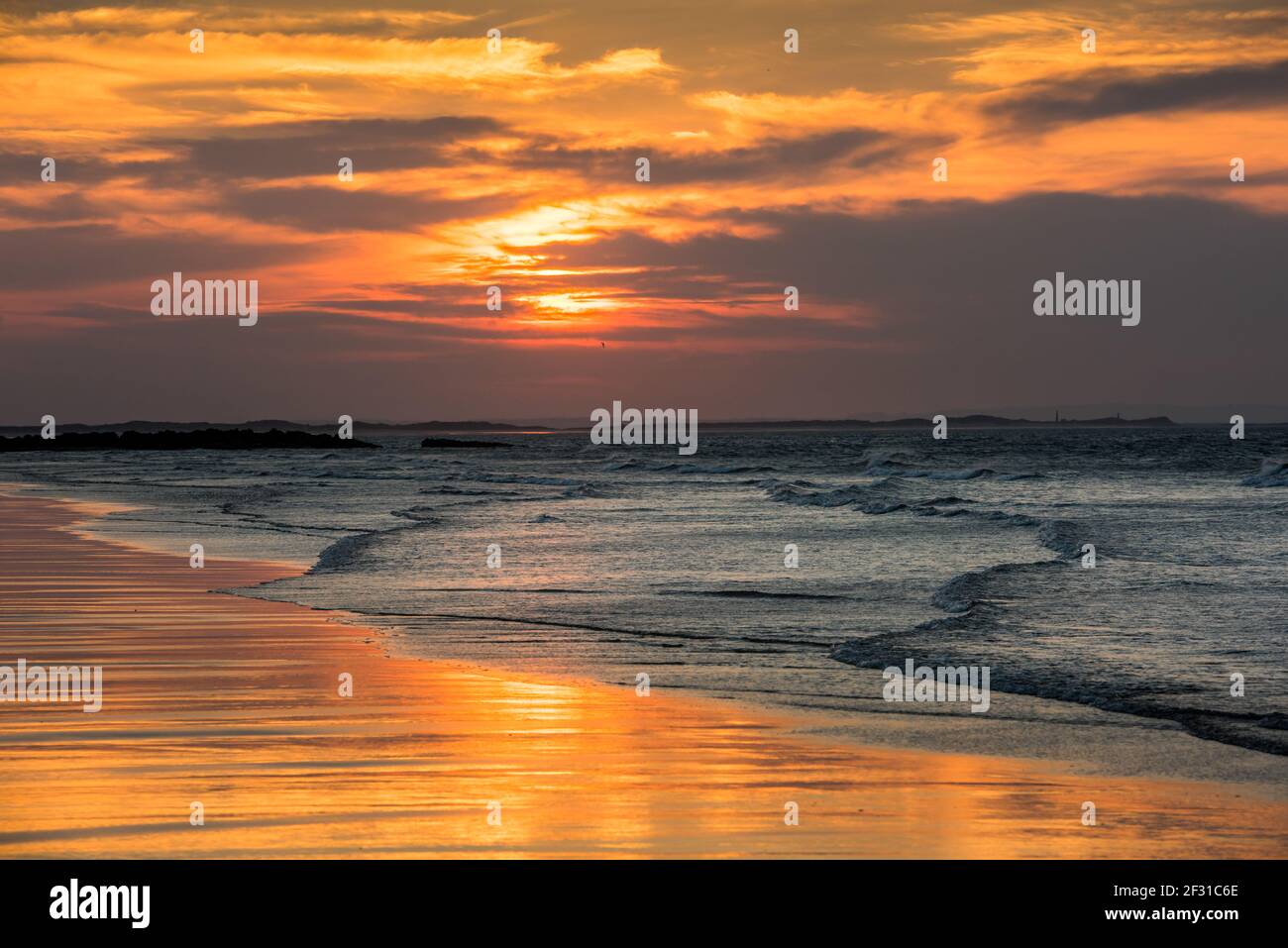 Beach sunset in Northumberland, England, UK Stock Photo - Alamy