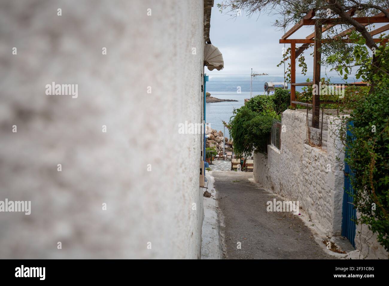 A narrow alley between buildings leading to t Stock Photo - Alamy