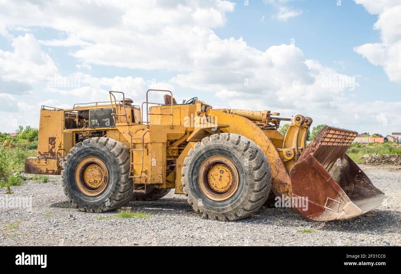 Old Rusty Industrial construction equipment Bulldozer excavator loader ...