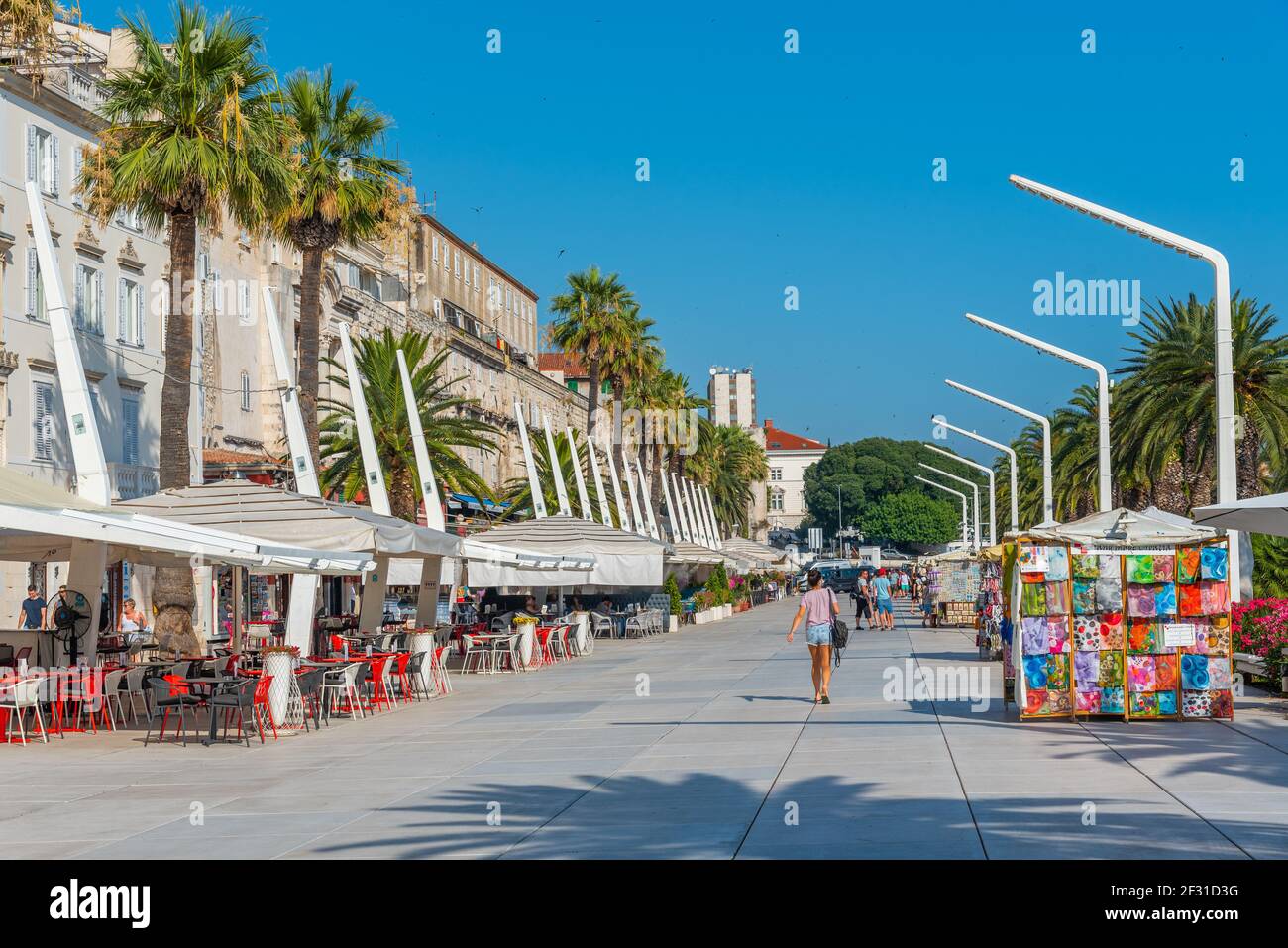 Split, Croatia, July 24, 2020: People are walking on seaside promenade ...