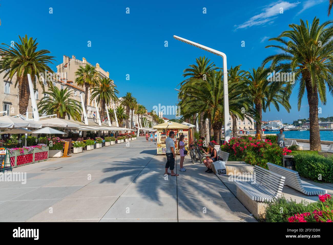Split, Croatia, July 24, 2020: People are walking on seaside promenade ...