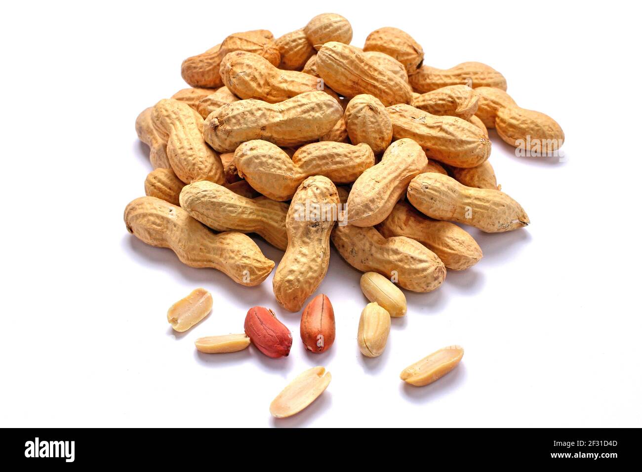 Roasted peanuts in shell isolated on light background Stock Photo - Alamy