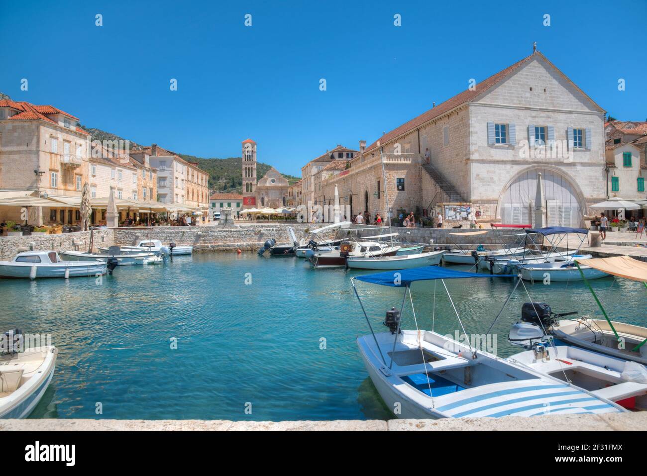 Hvar, Croatia, July 29, 2020: Boats at port of Hvar with cathedral of ...