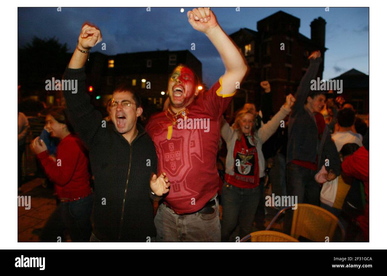 Portugese fans celebrate their win against England in Euro 2004 outside ...