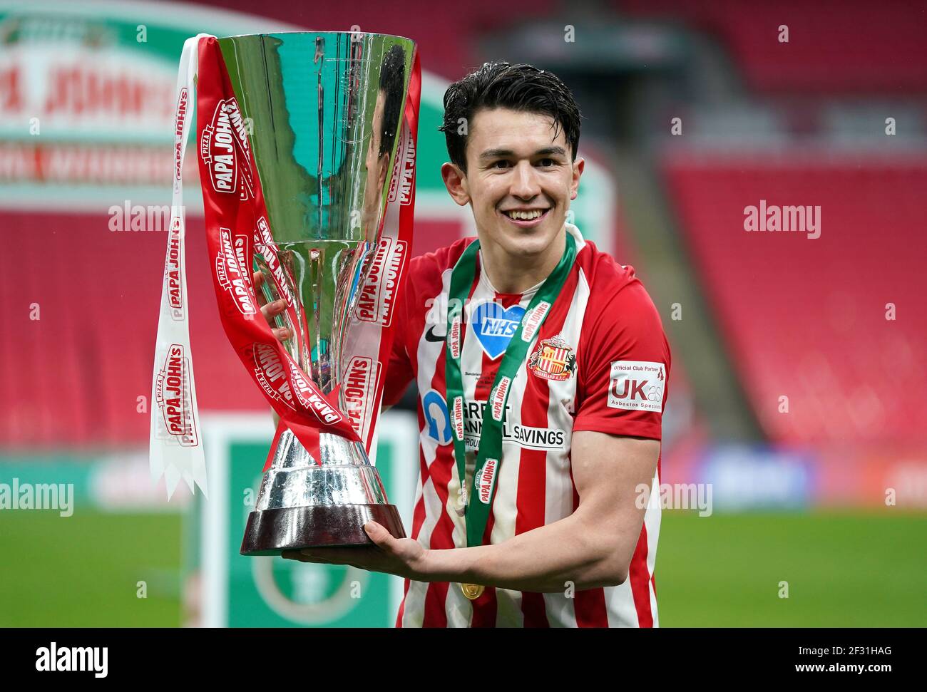Sunderland's Luke O'Nien celebrates with the Papa John's Trophy after ...
