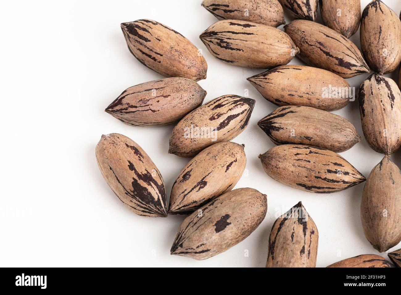 Pecan nuts in shell set on plain white background Stock Photo - Alamy