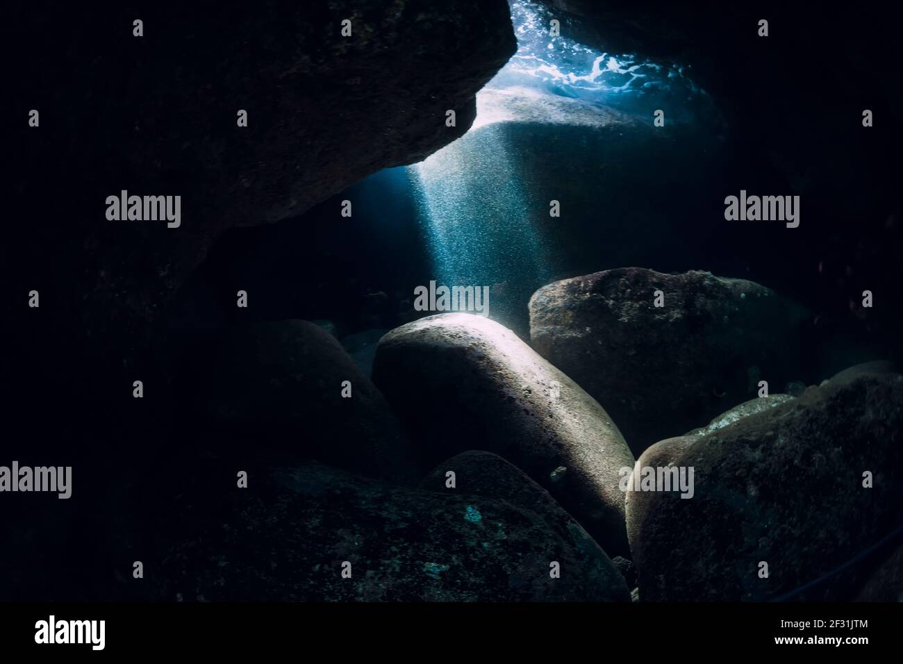 Underwater cave in ocean with sun rays Stock Photo - Alamy