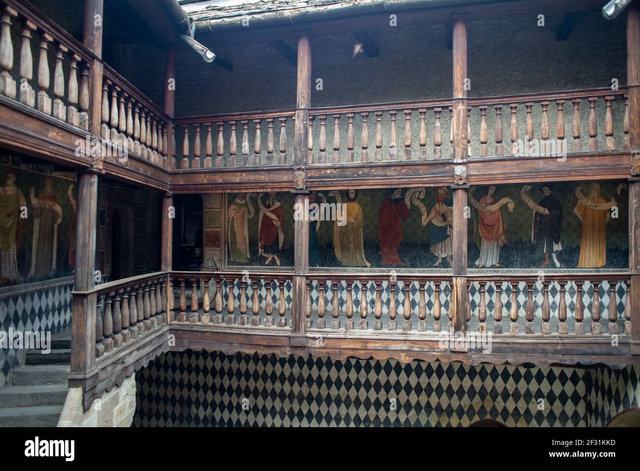 Two-story wooden gallery in the central court of the Fenis Castle in ...