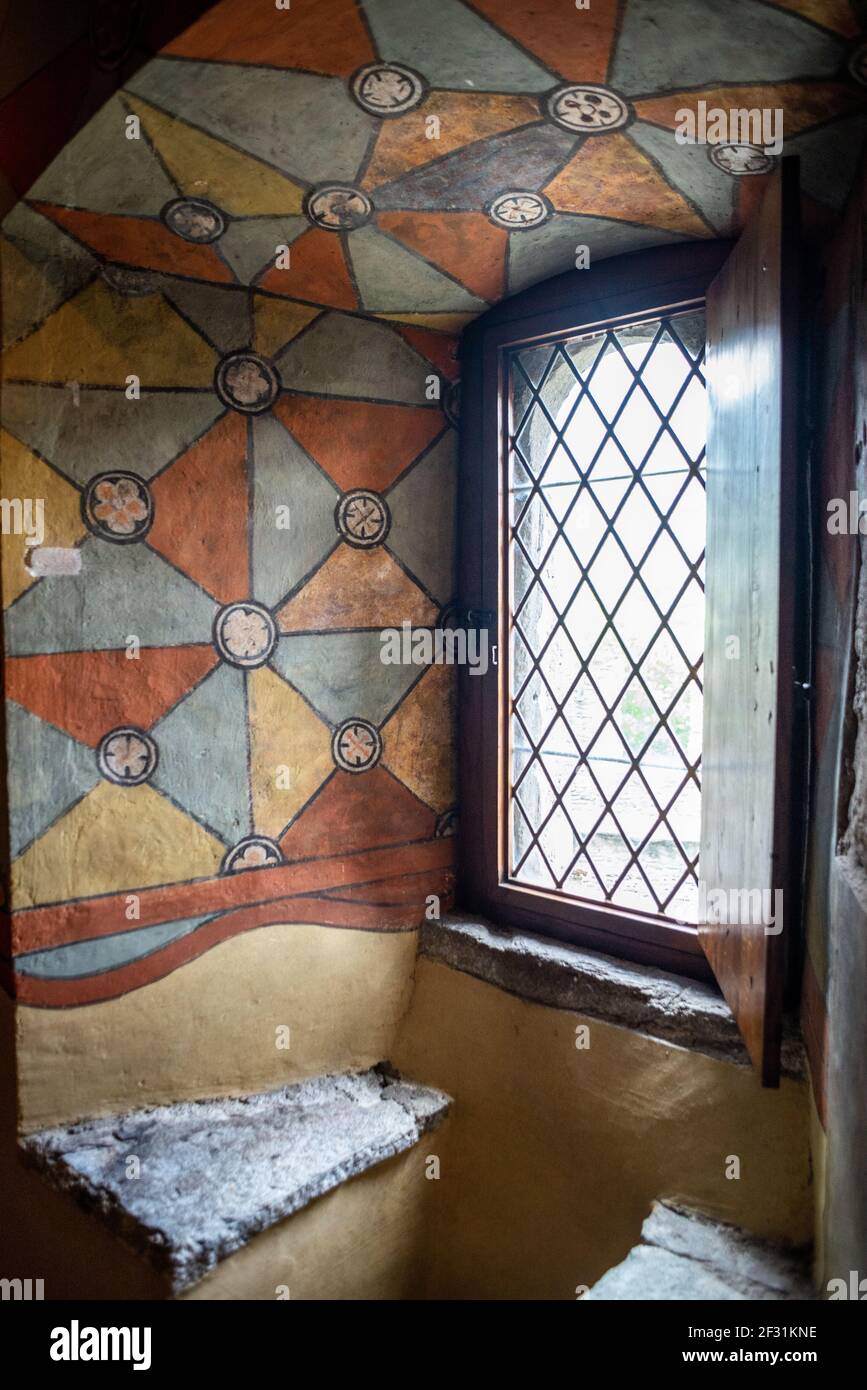A decorated niche in the wall of one of the rooms of Fenis Castle ...