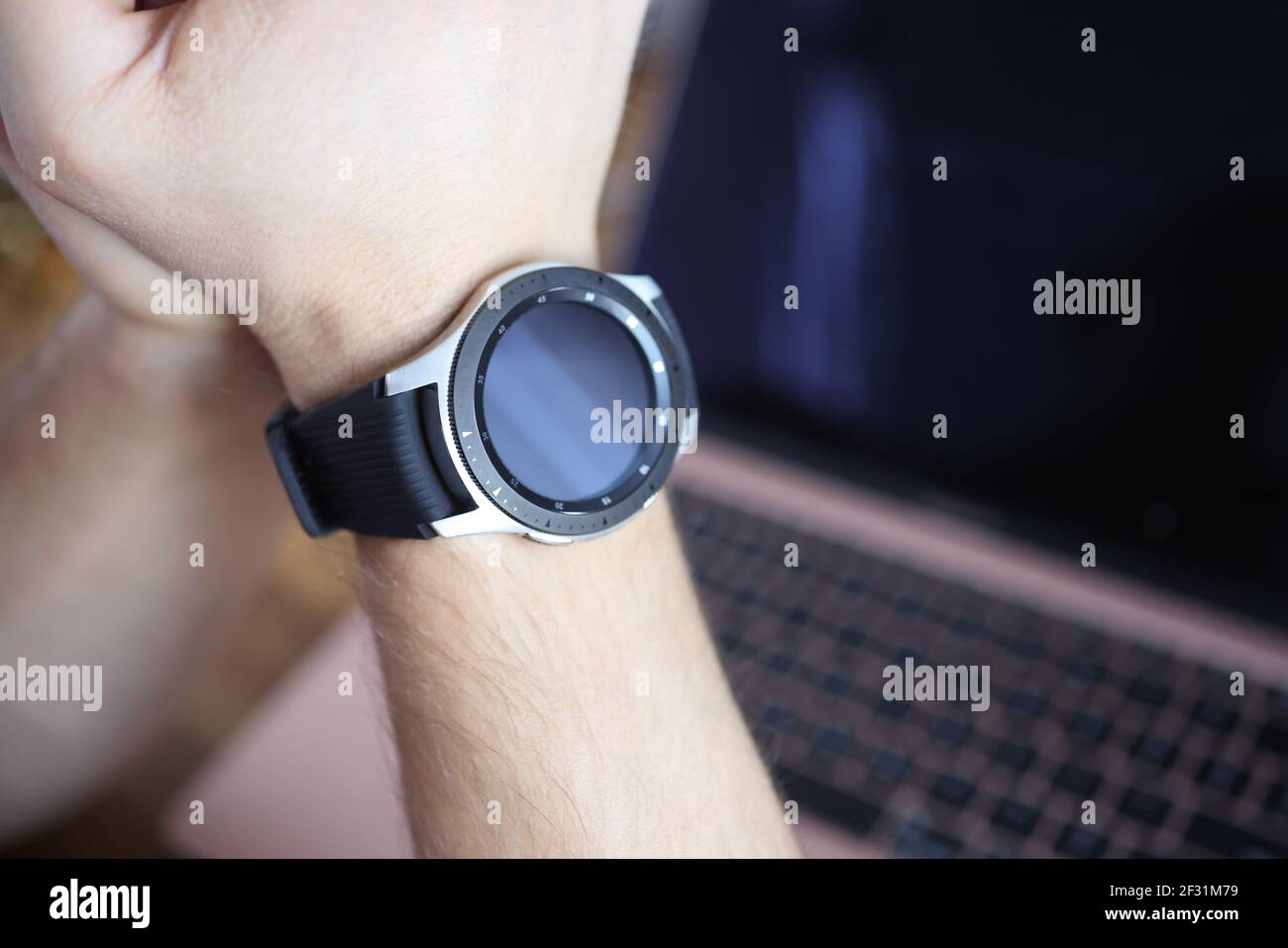 Smart watch is worn on man hand Stock Photo - Alamy
