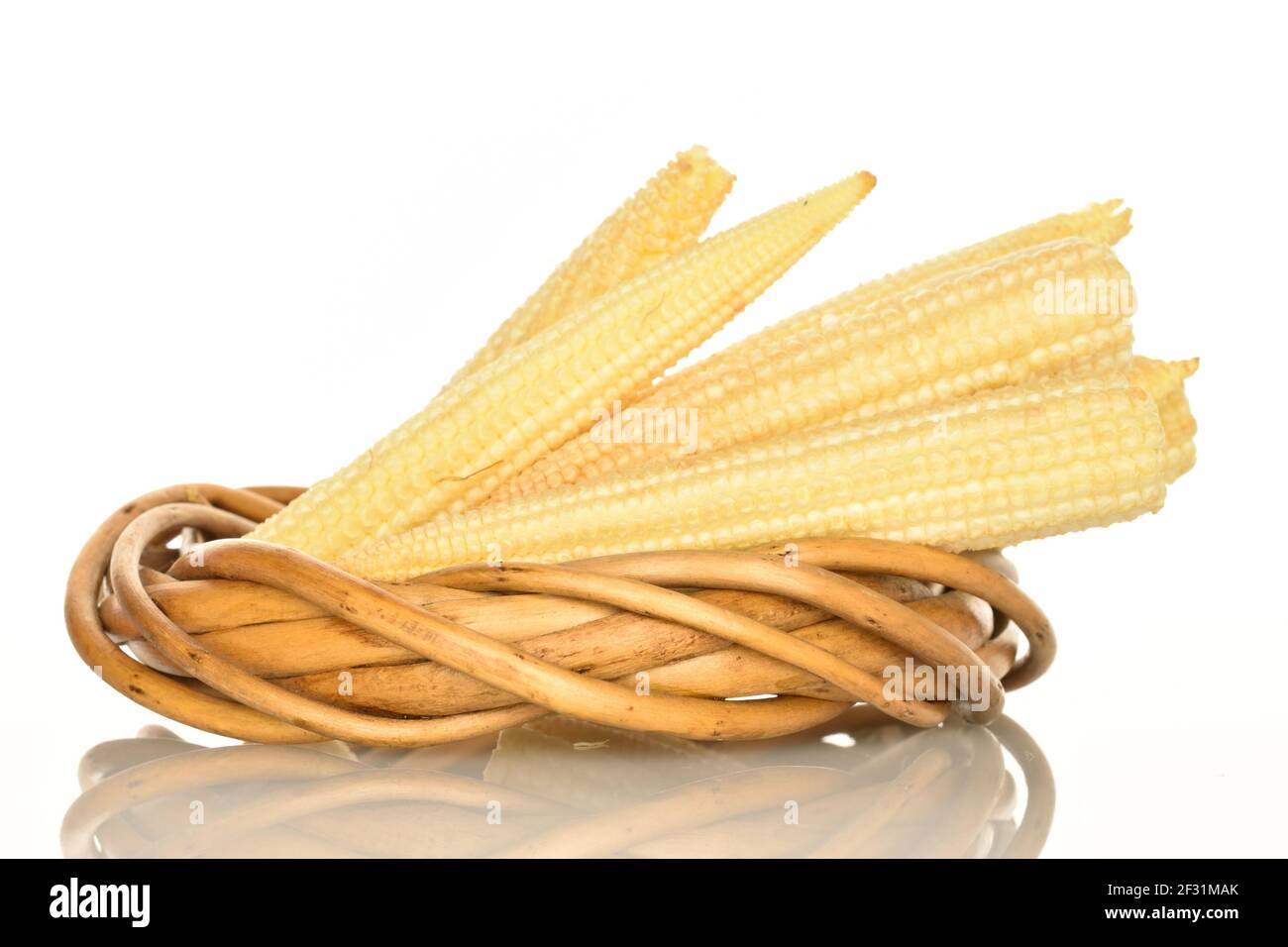 A few bright yellow ripe sweet organic mini mini corn, with a wreath of ...