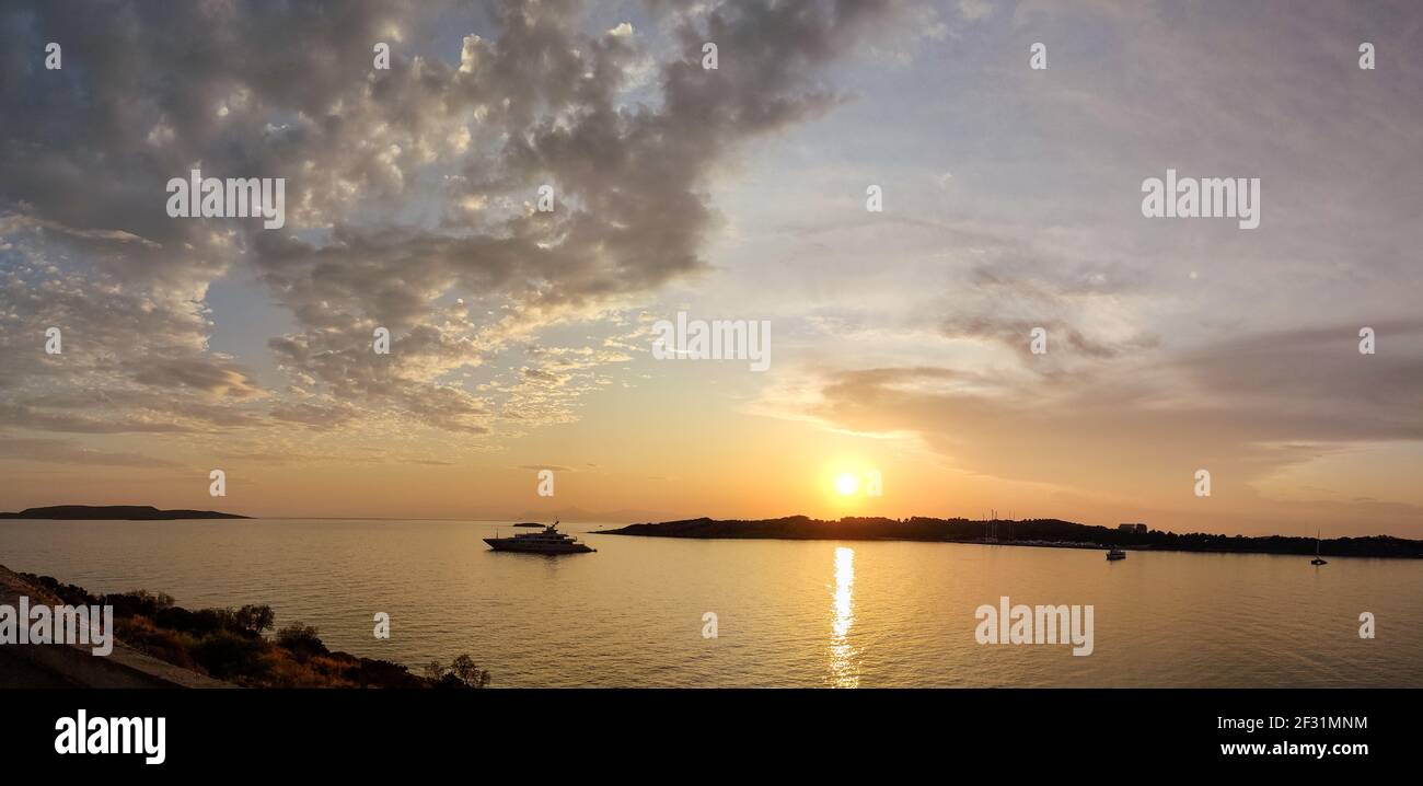 Orange sunset sun shining above Greek islands in Aegean sea. Panorama ...