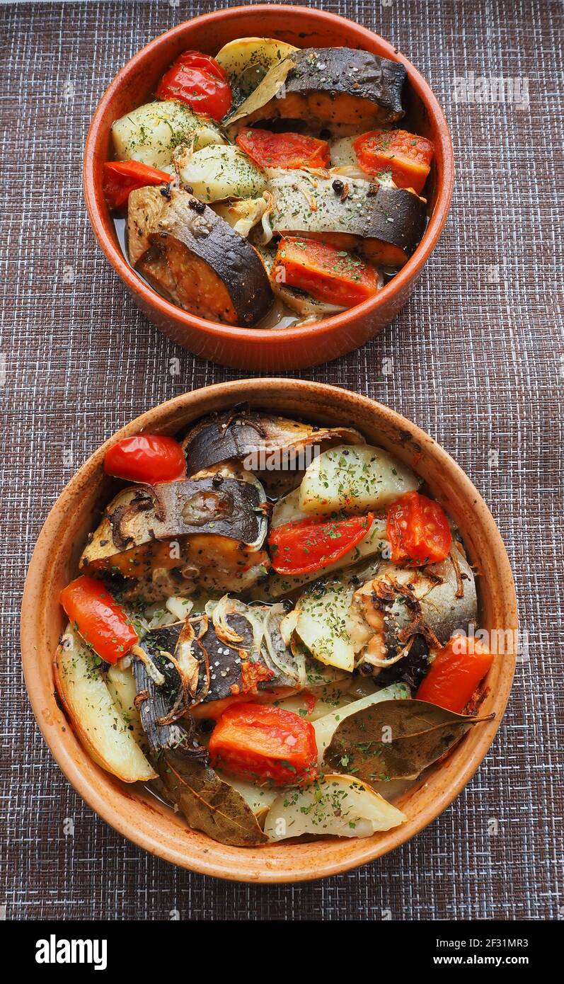 A dish of fish with vegetables Stock Photo - Alamy