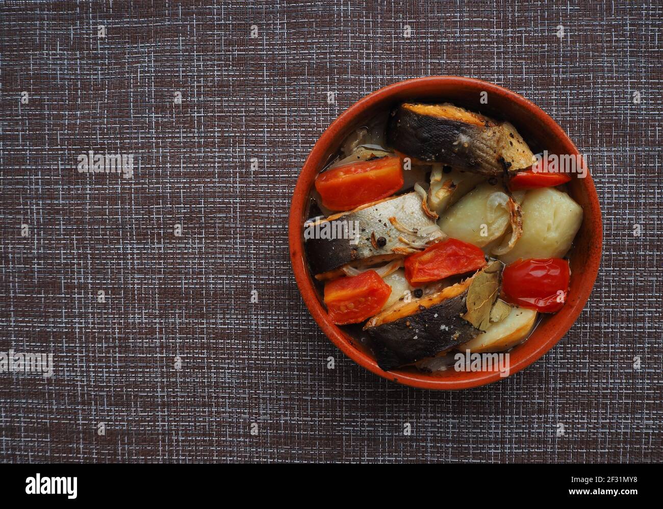 A dish of fish with vegetables Stock Photo - Alamy