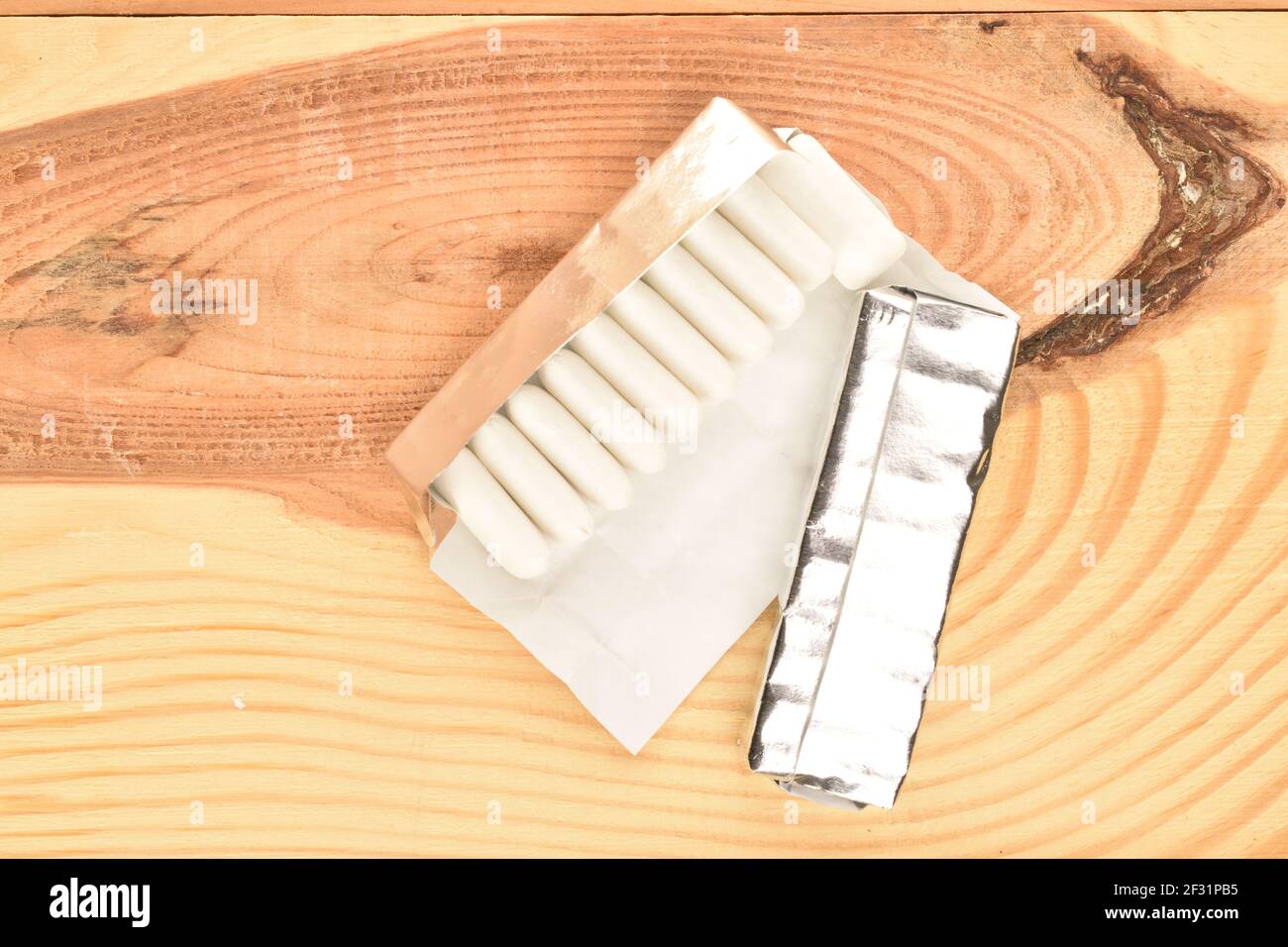 A few white fresh mint pads of chewing gum, close-up, on a background ...