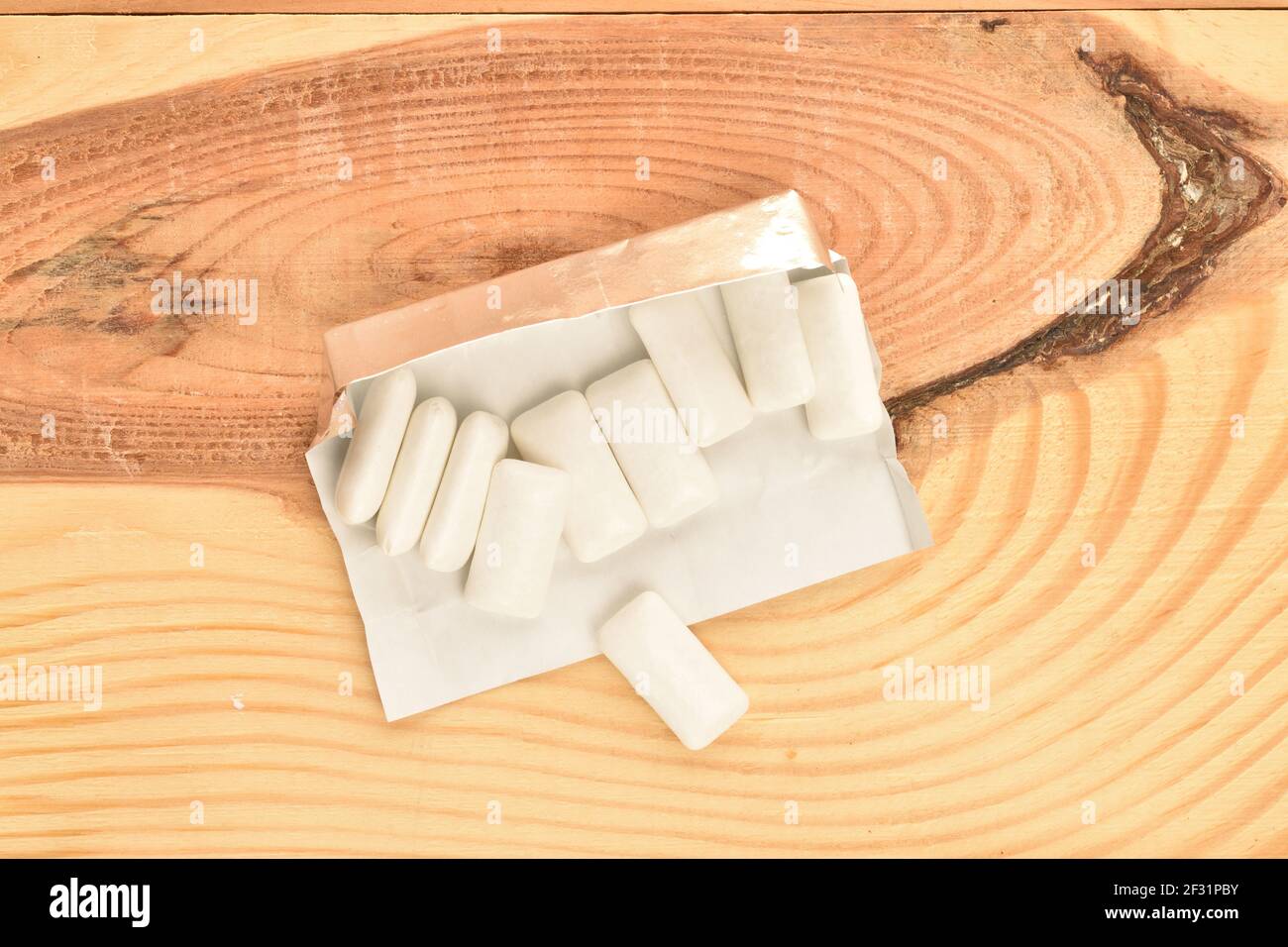 A few white fresh mint pads of chewing gum, close-up, on a background ...
