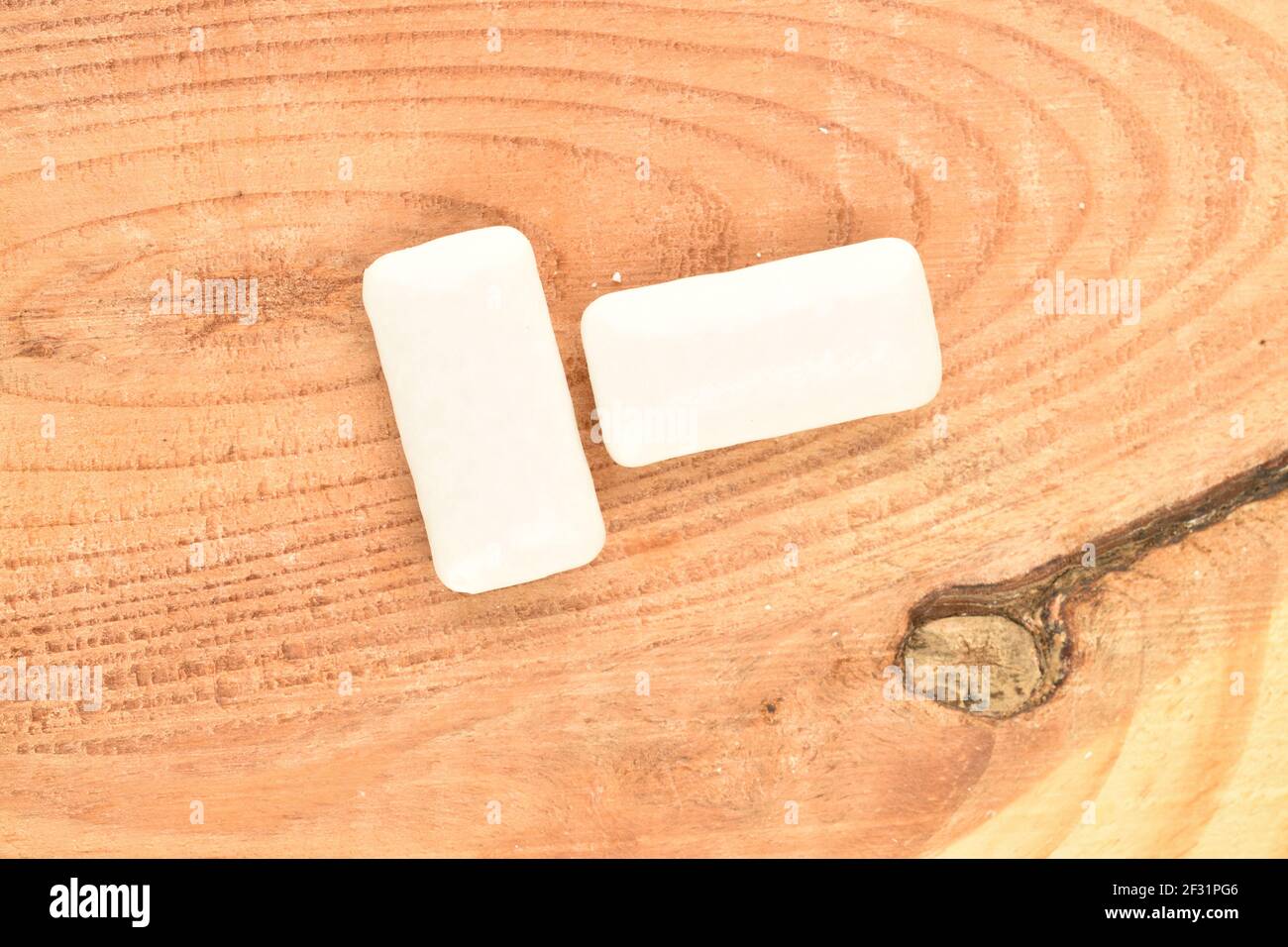 Two white fresh mint pads of chewing gum, close-up, on a background of ...