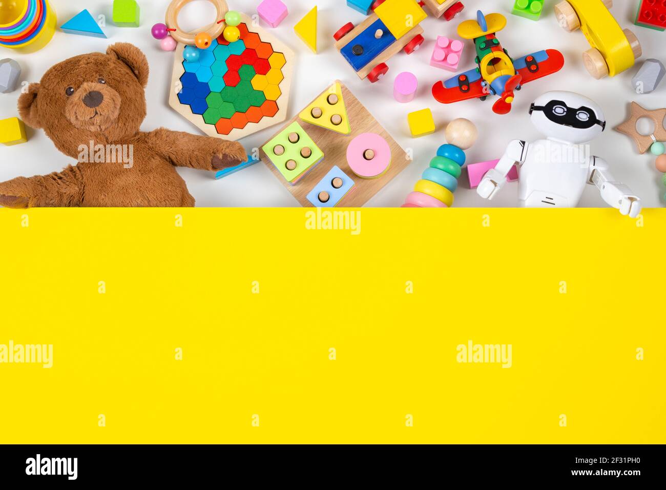 Top view to colorful educational baby kids toys and blank yellow ...