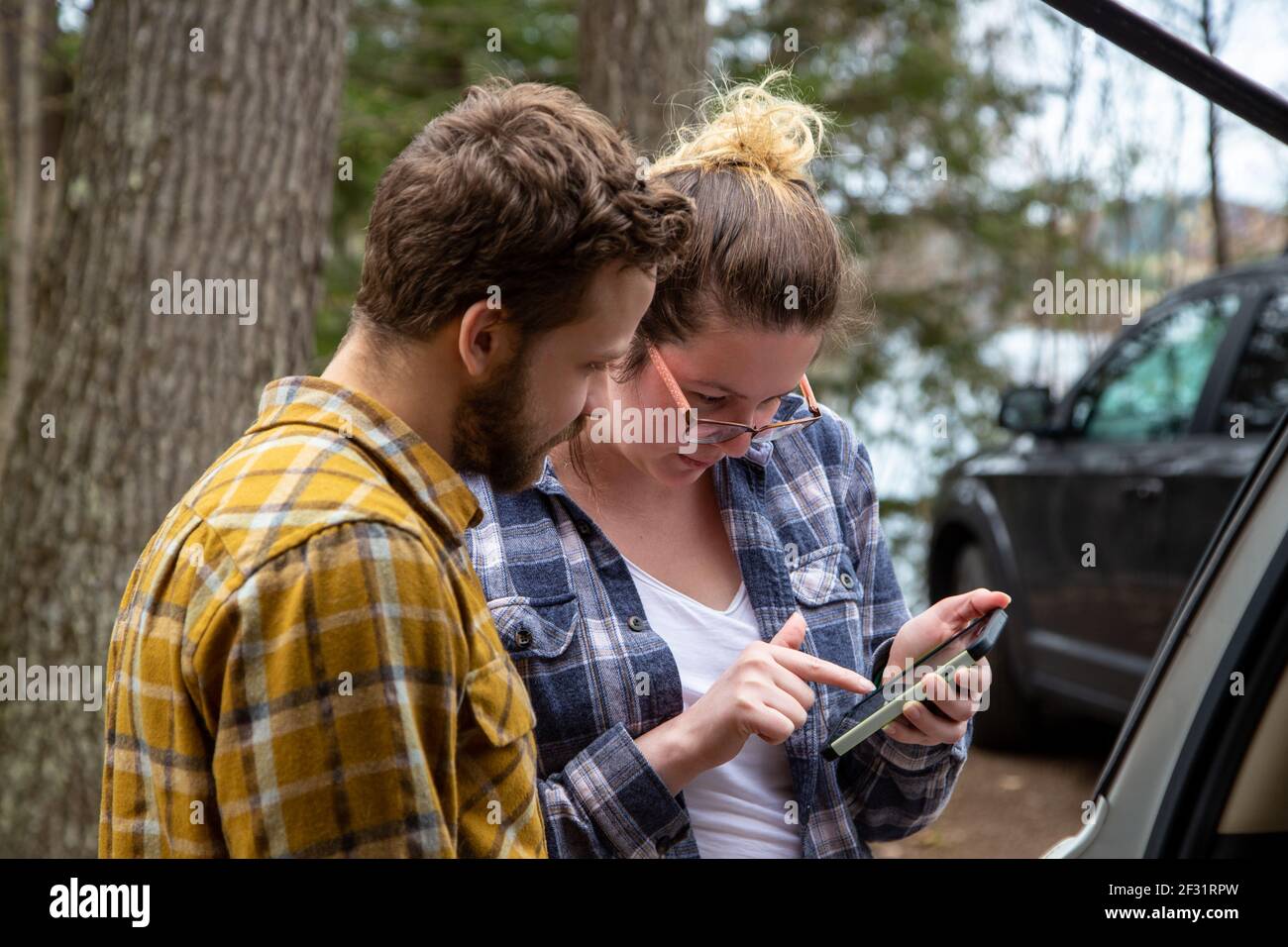 Travelers consulting gps guide hi-res stock photography and images - Alamy