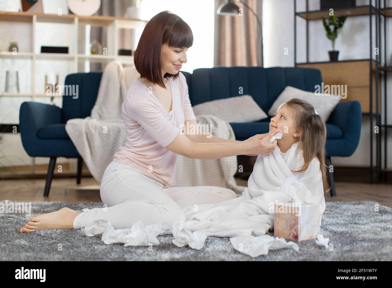 Woman wiping child face hi-res stock photography and images - Alamy
