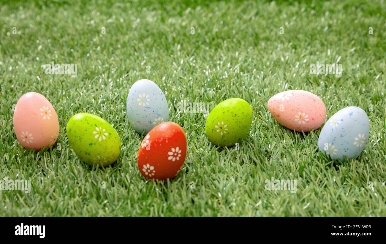 Easter eggs hunt concept. Happy Easter greeting card. Colorful eggs on ...