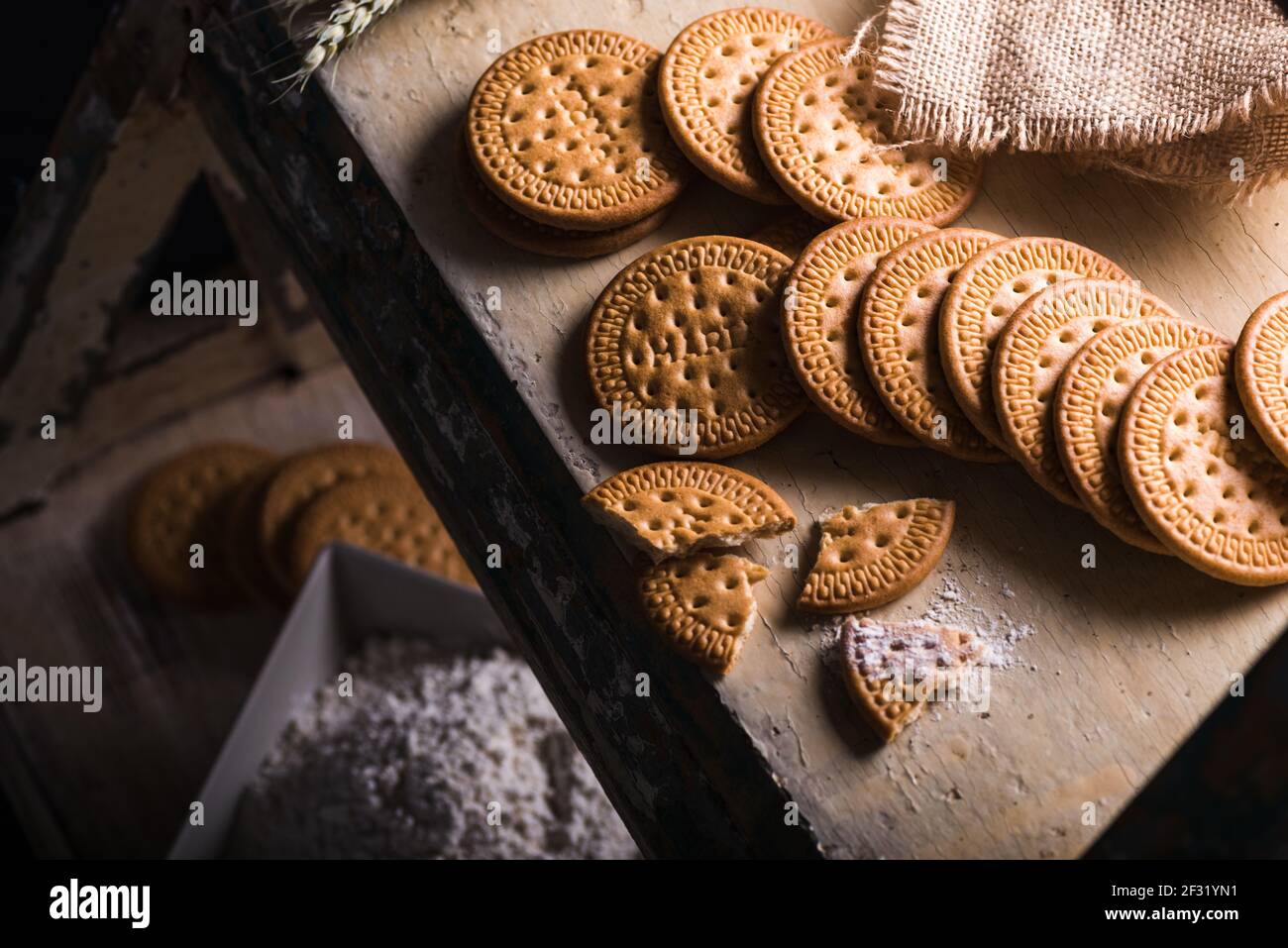A closeup shot of tasty cookies on a rusty surface on a black ...