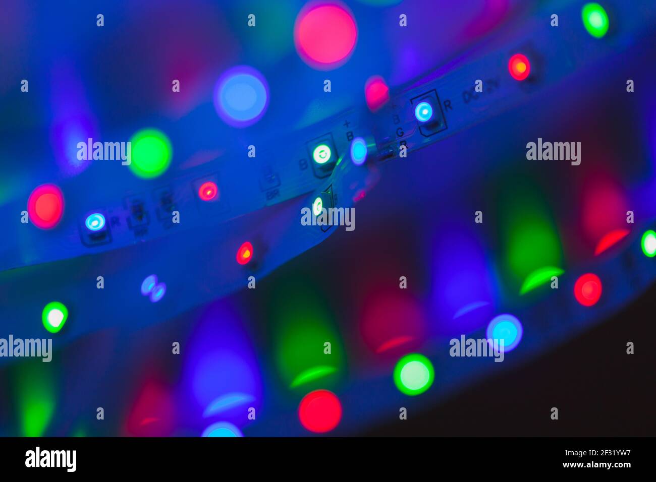 Colorful LED strip lights glow in the dark, close up photo with ...