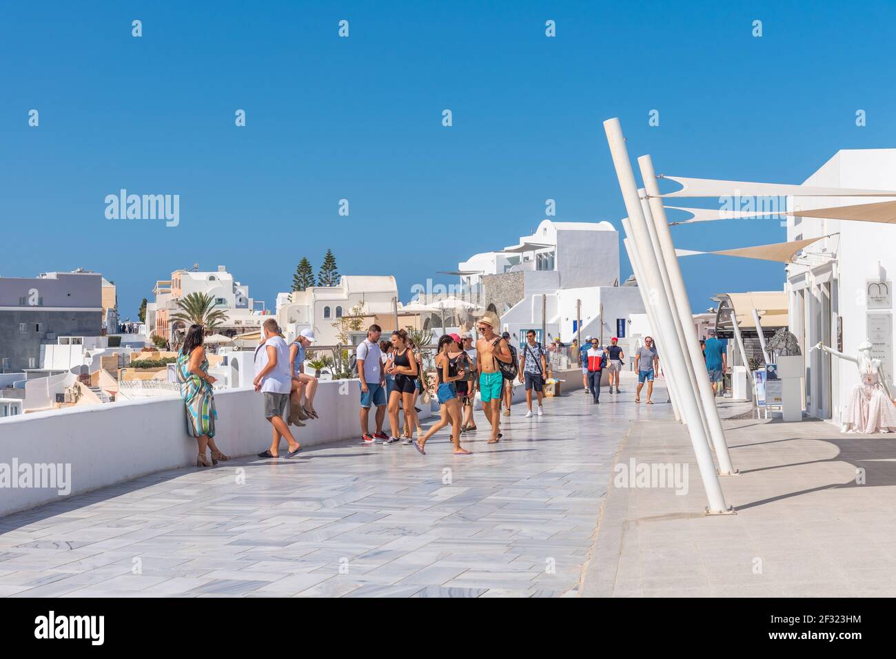 Santorini, Greece, September 25, 2020: People are strolling thorugh a ...