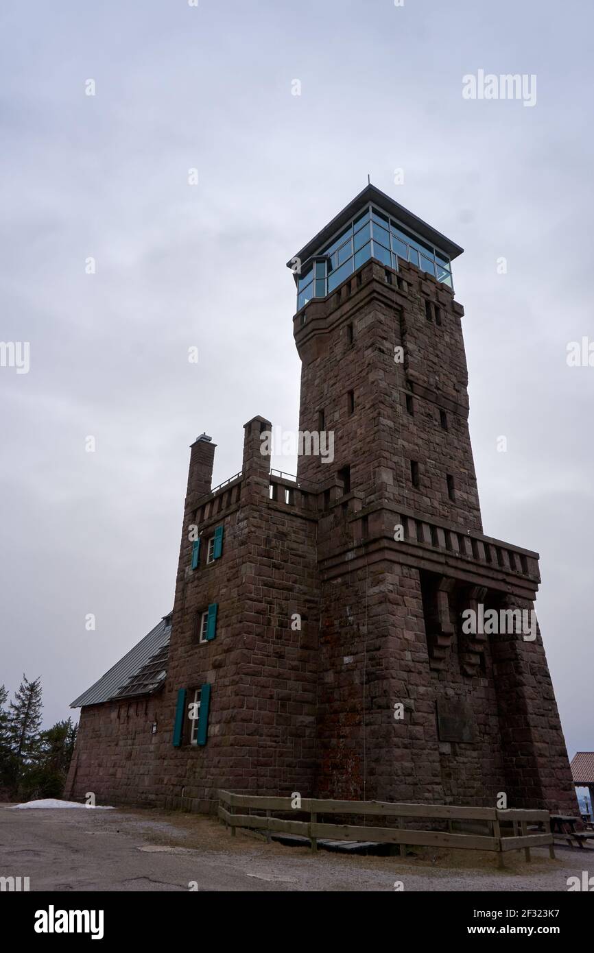 A low angle closeup view of a tall church tower building in the city on ...