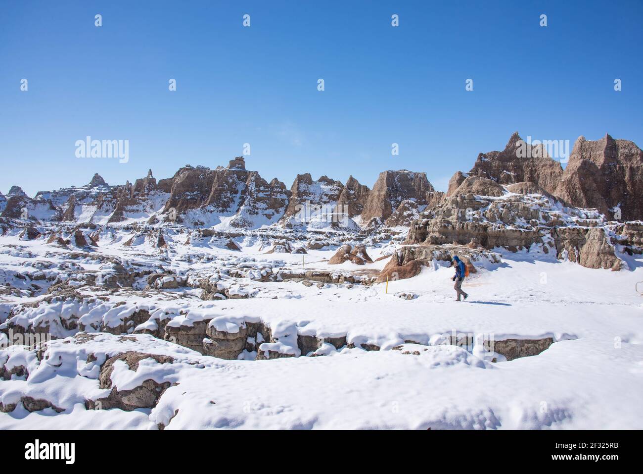 Trekking in Badlands National Park in winter, South Dakota, U. S. A ...