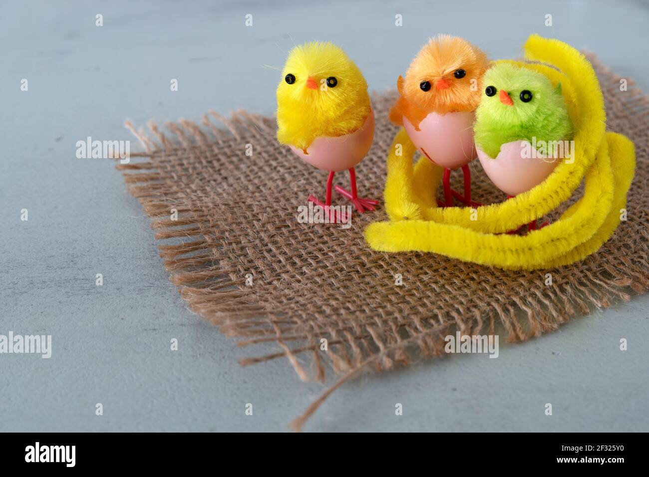 Three little colored chicks easter Stock Photo - Alamy