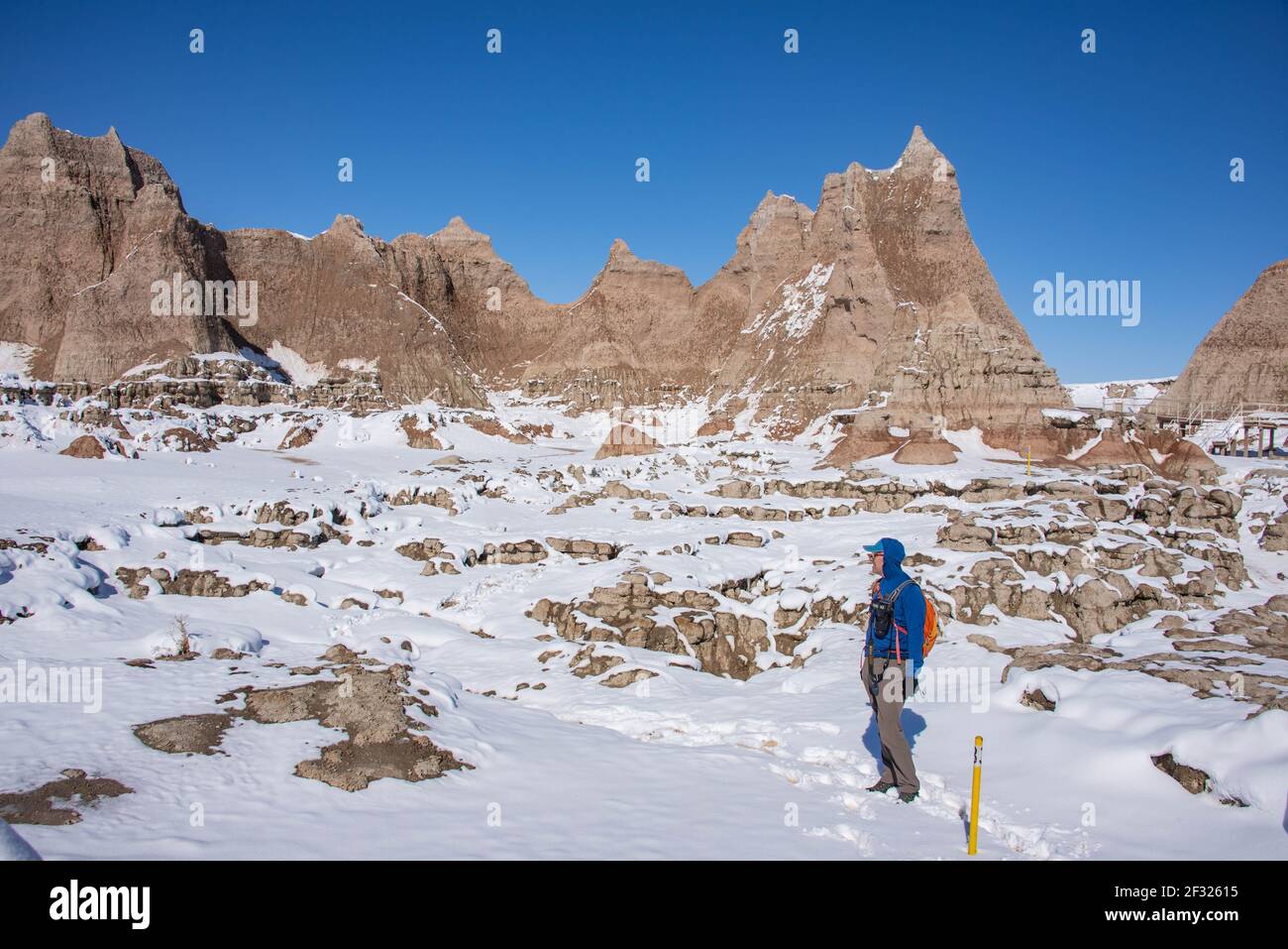 Trekking in Badlands National Park in winter, South Dakota, U. S. A ...