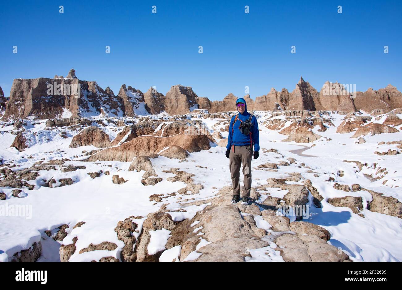 Trekking in Badlands National Park in winter, South Dakota, U. S. A ...