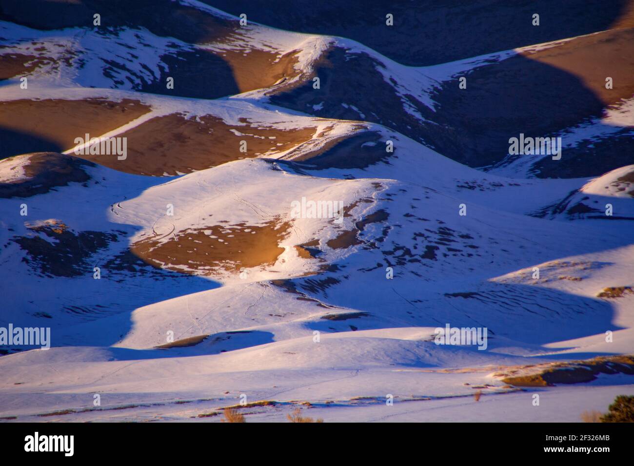 Melting snow creates patterns on the dunes at the Great Sand Dunes ...